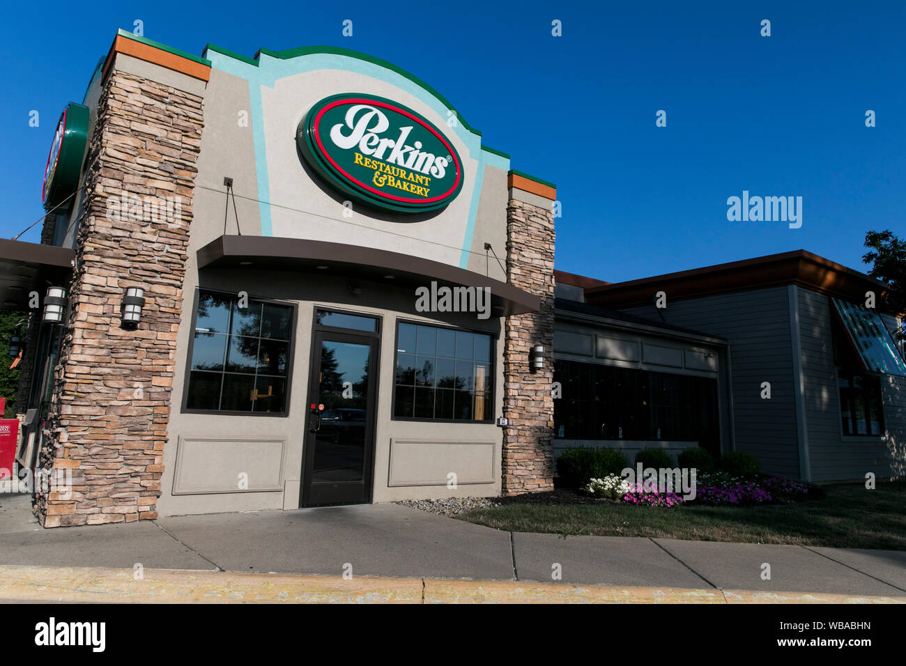 A logo sign outside of a Perkins Restaurant & Bakery location in Avon ...