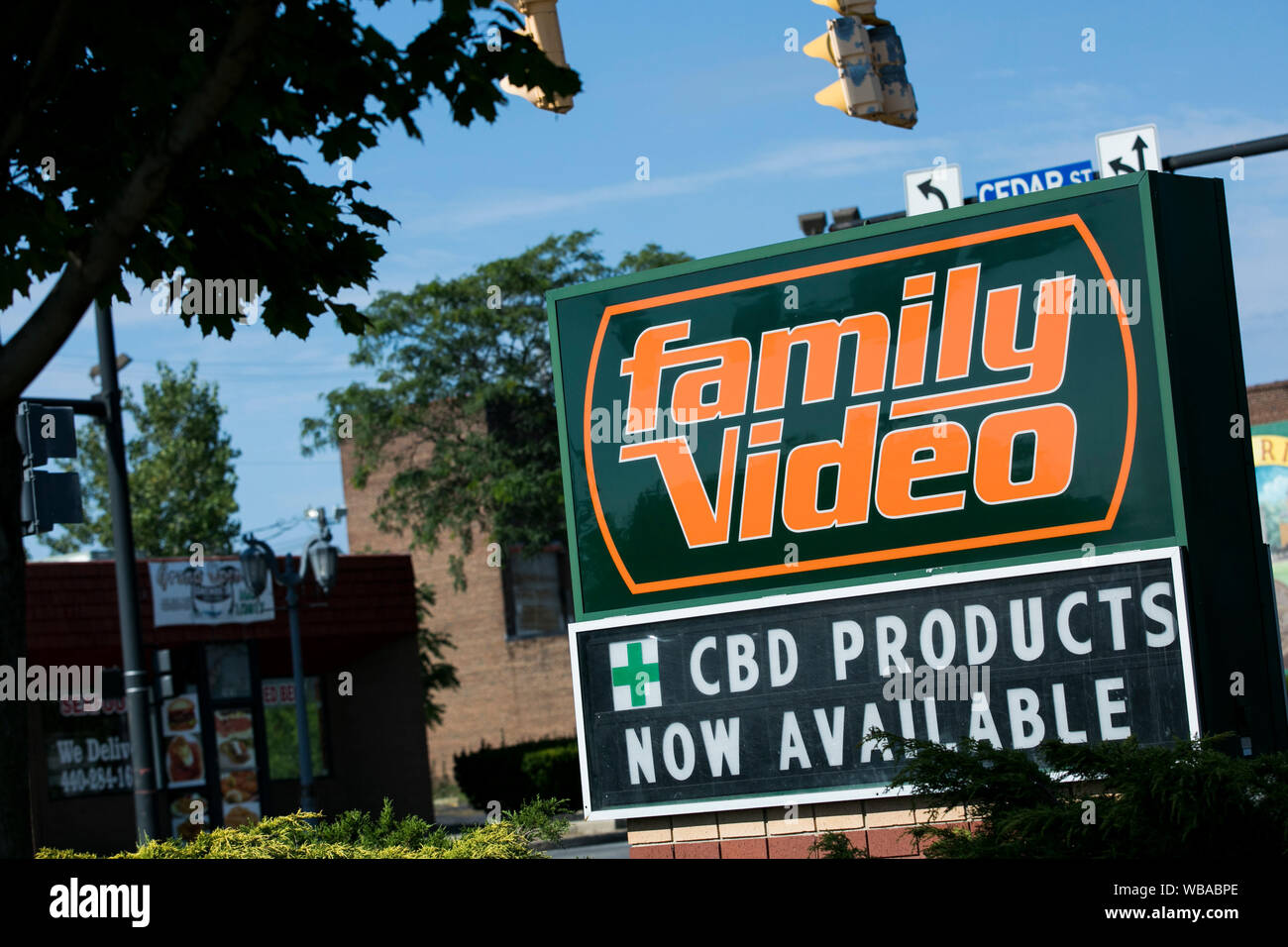 A logo sign outside of a Family Video retail store location in Elyria ...