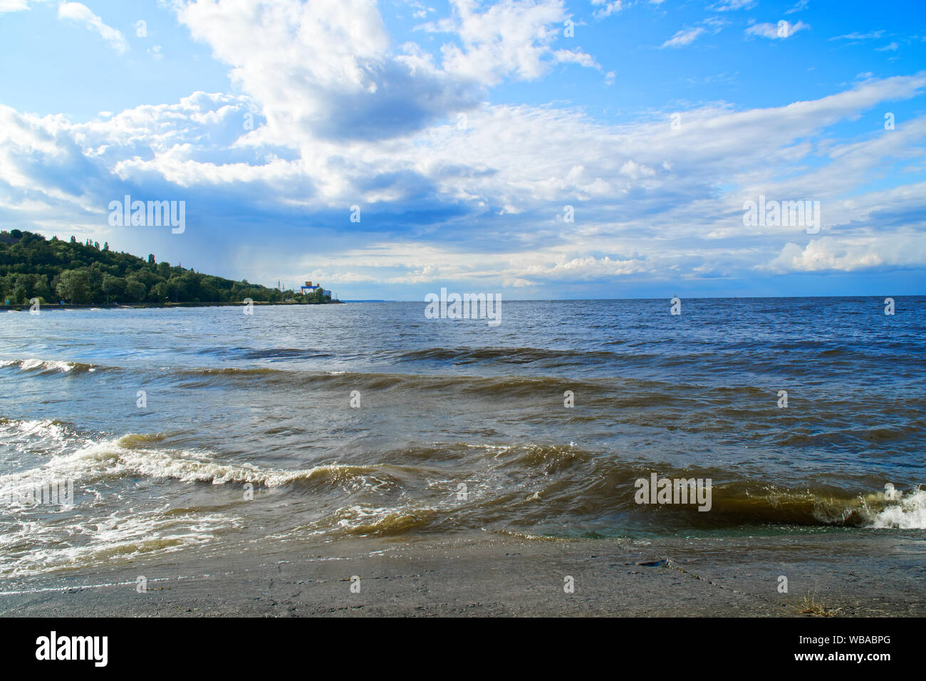 Surging wave on the Kyiv sea reservoir, water reflection, foam and sun ...