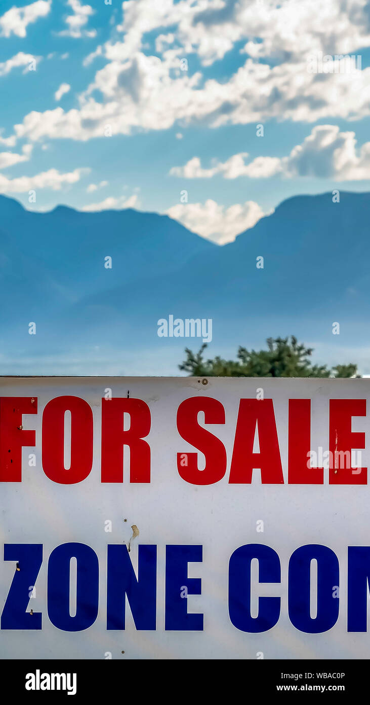 Vertical frame For Sale real estate sign with lake mountain and cloudy ...