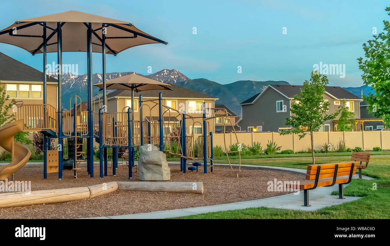 Panorama frame Park with playground and benches in front of multi ...
