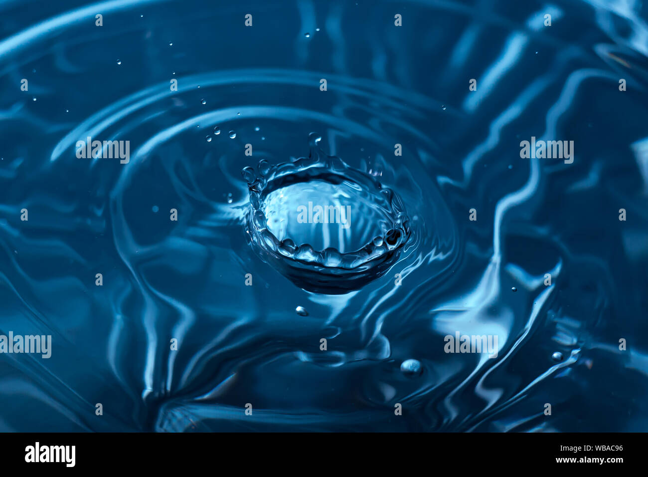 Drop of water. Blue water drop. Falling water. Water splash close-up ...