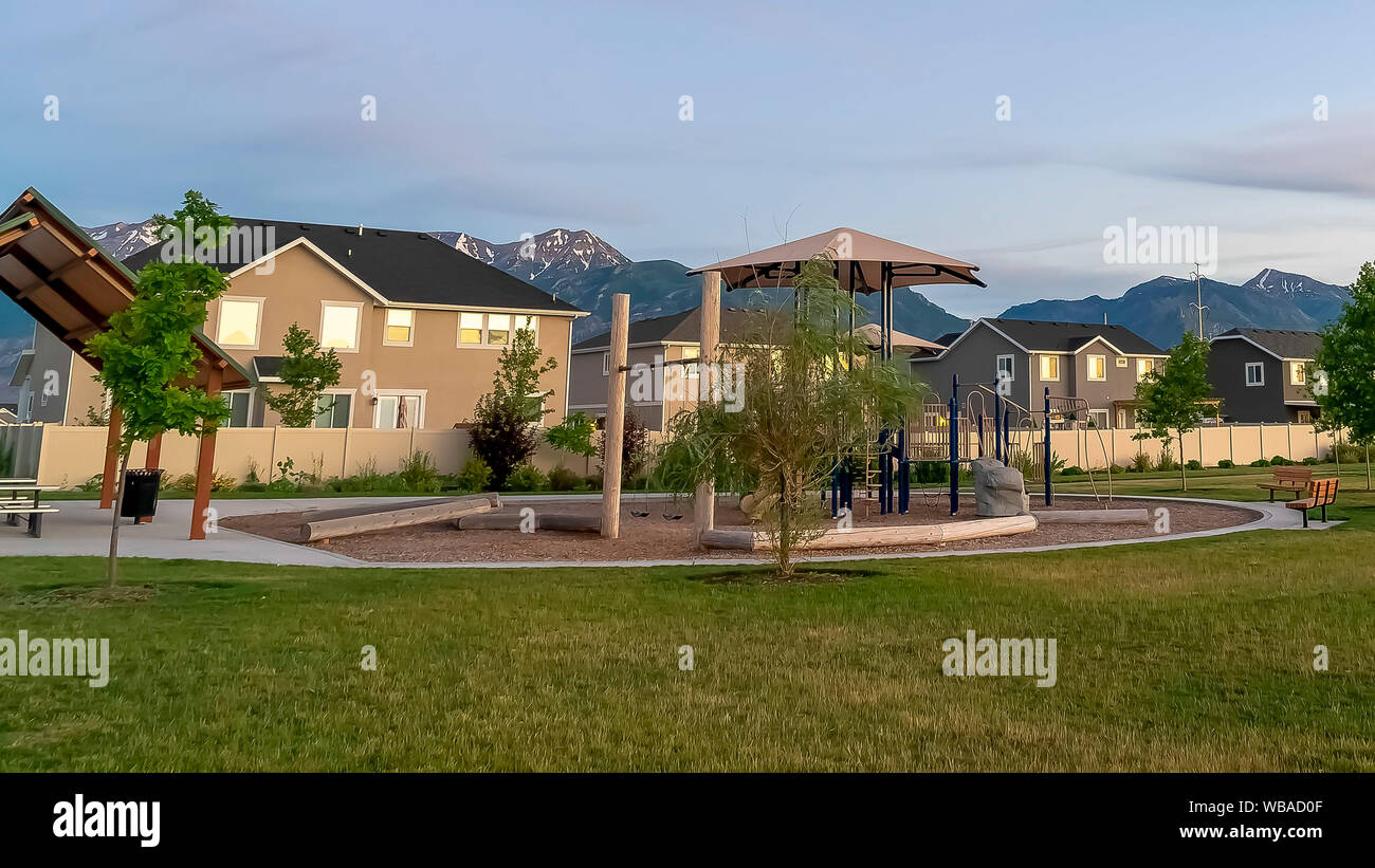 Panorama Peaceful neighborhood with playground and pavilion in front of ...