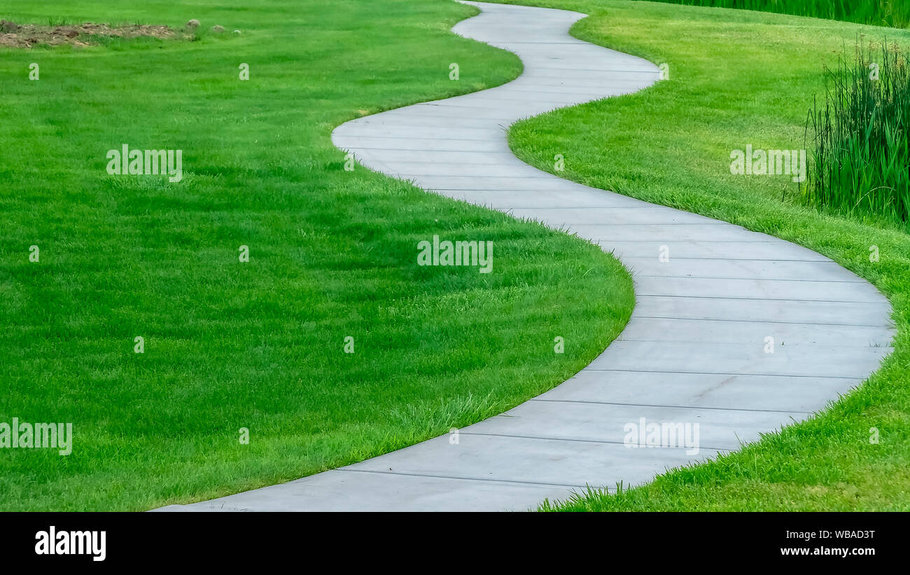 Panorama Close up of a pathway winding though a terrain covered with ...