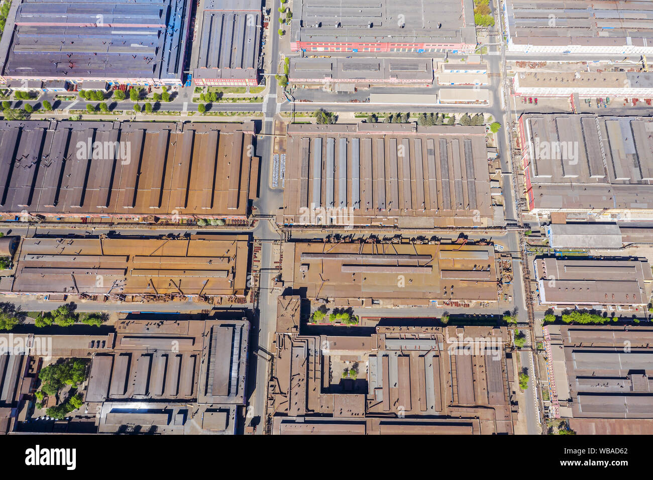 manufacturing building in urban industrial area. roofs of industrial ...