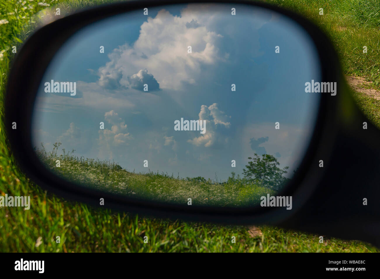 Natural landscape - a reflection in the mirror of the car. Background ...