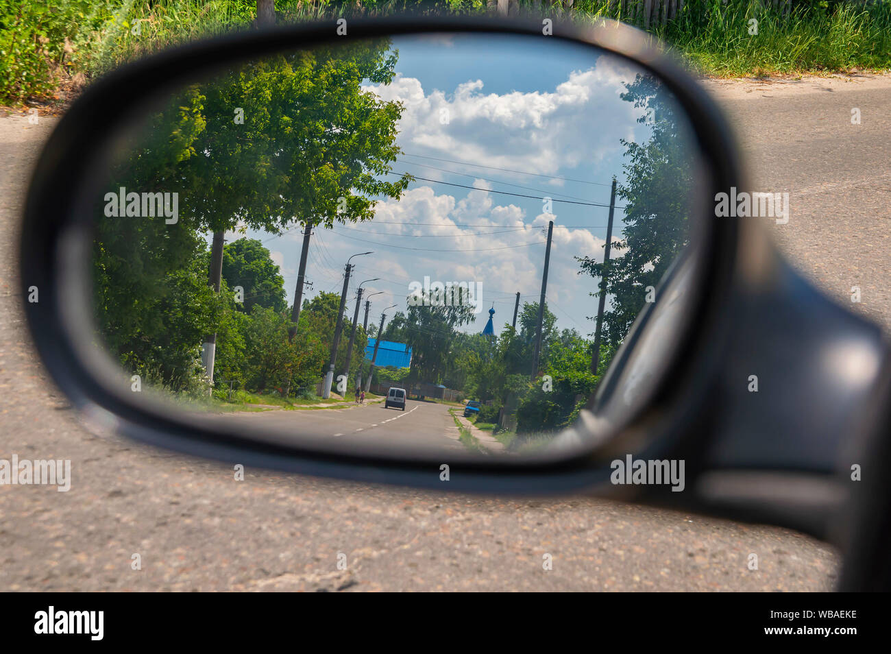 Natural landscape - a reflection in the mirror of the car. Background ...