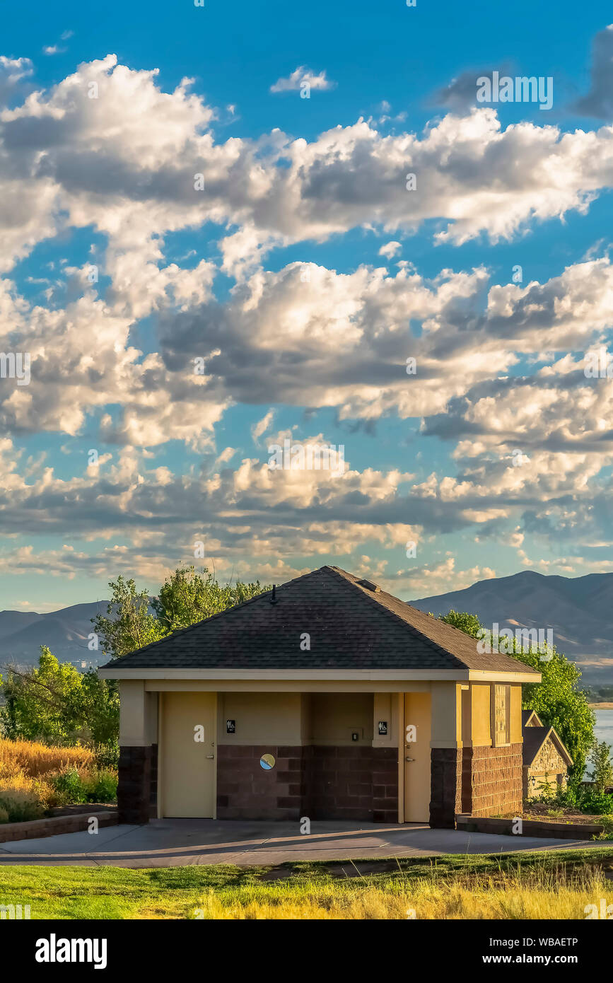 Public restroom on a park with view of lake and mountain in the ...