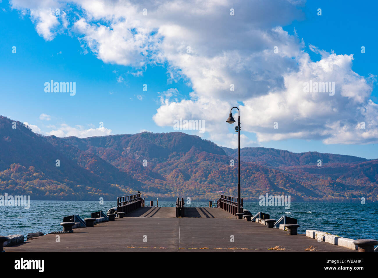 Beautiful view from Lake Towada lakeside pier, clear sky with blue ...
