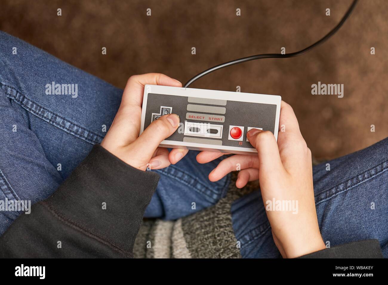Playing an old gaming console Stock Photo - Alamy
