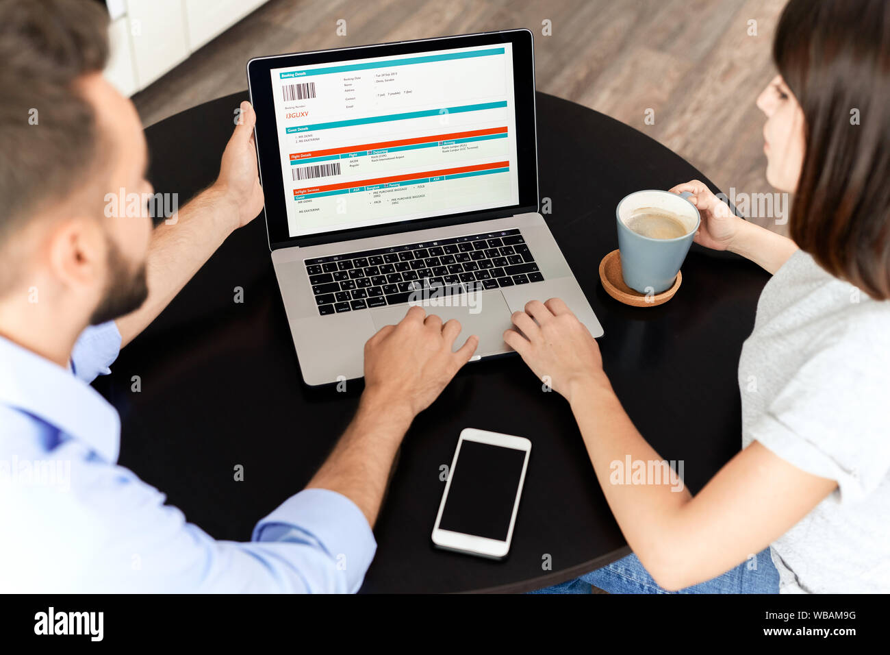 Checking order online in laptop Stock Photo - Alamy