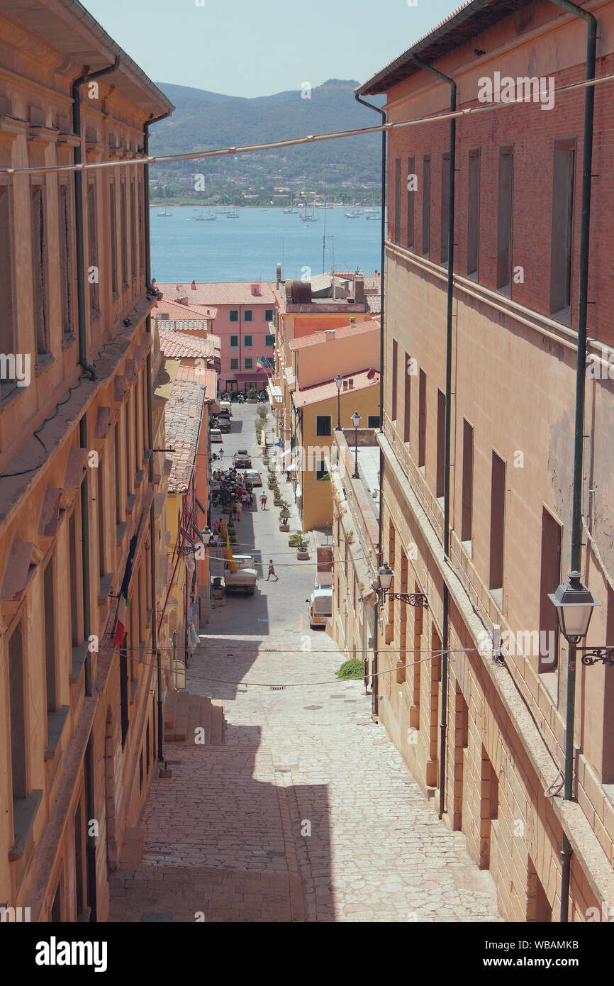 Street in historic centre of medieval town. Portoferraio, Elba Island ...