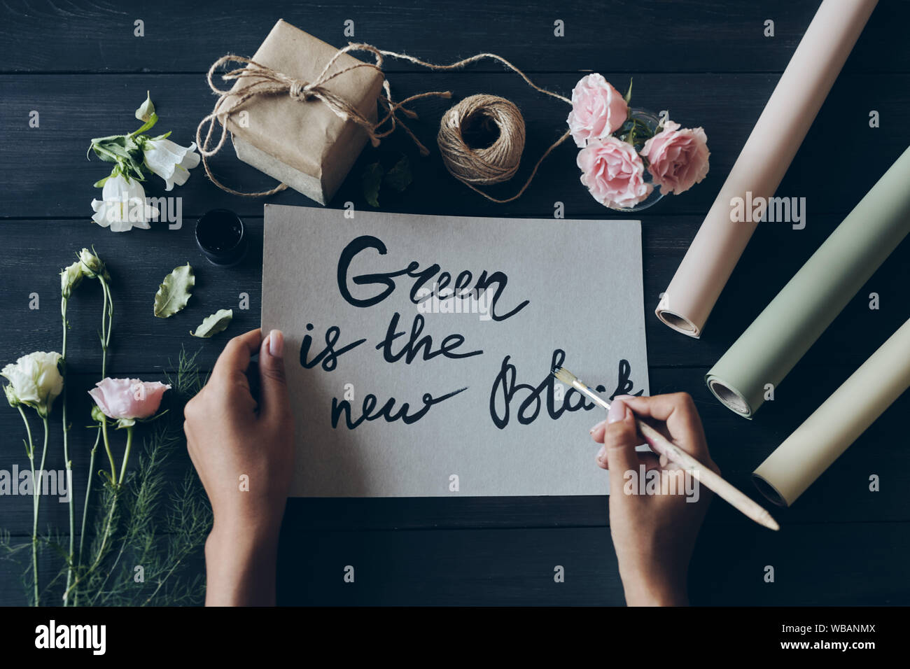 Designer writing calligraphy with paintbrush Stock Photo - Alamy
