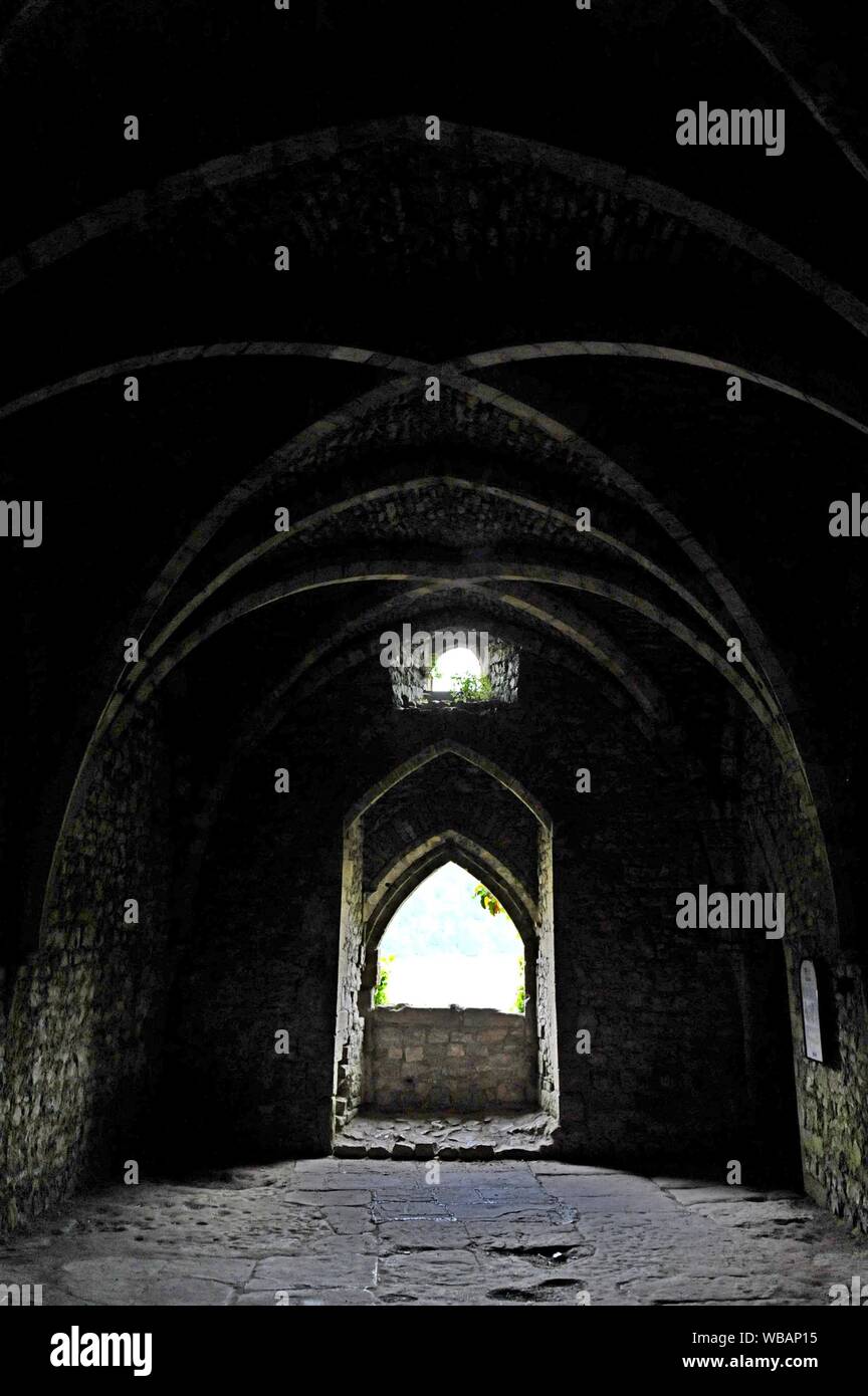 A cellar room with stone vaulting at Chepstow Castle, Wales Stock Photo ...