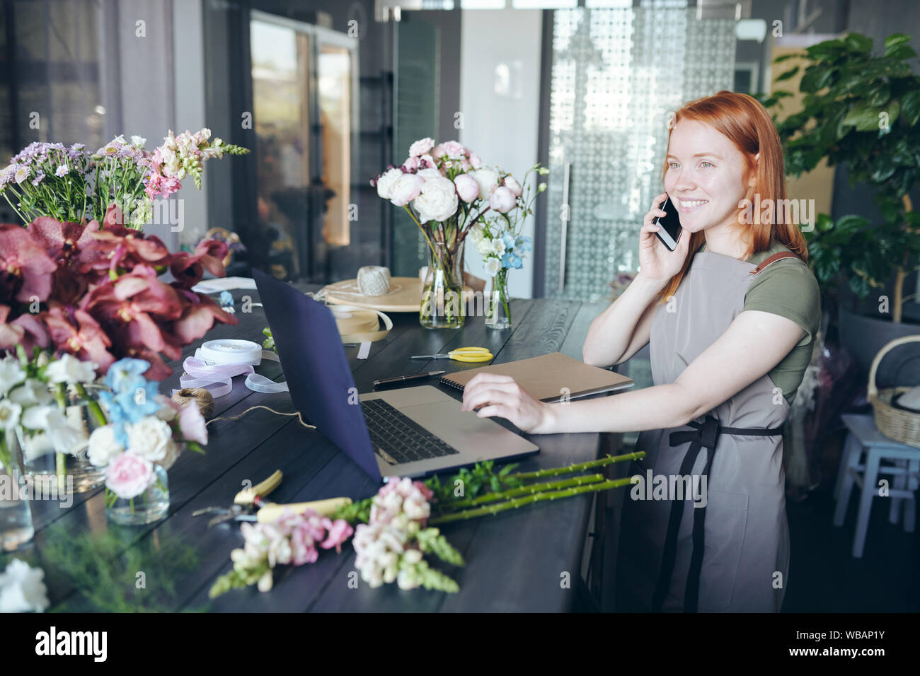 Beautiful young manager talking hi-res stock photography and images - Alamy
