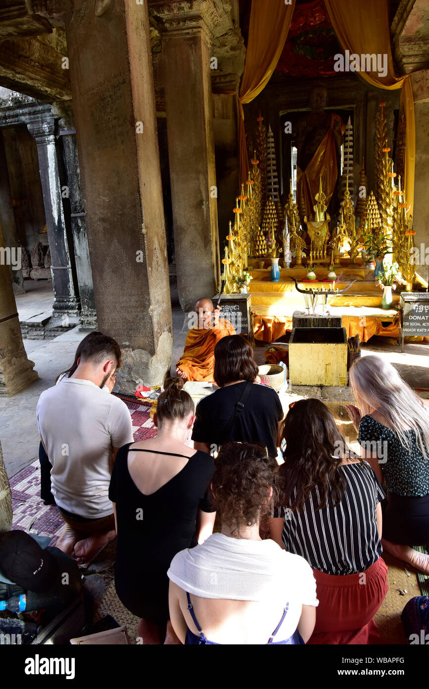 Monks giving blessings at Angkor Wat, Siem Reap, Cambodia Stock Photo ...