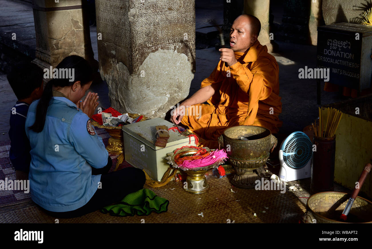 Monks giving blessings at Angkor Wat, Siem Reap, Cambodia Stock Photo ...