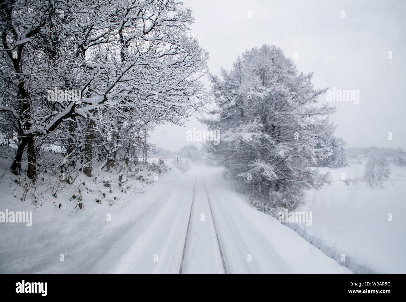 White Snow covered tracks on Tsugaru railway line in Aomori, Tohoku ...