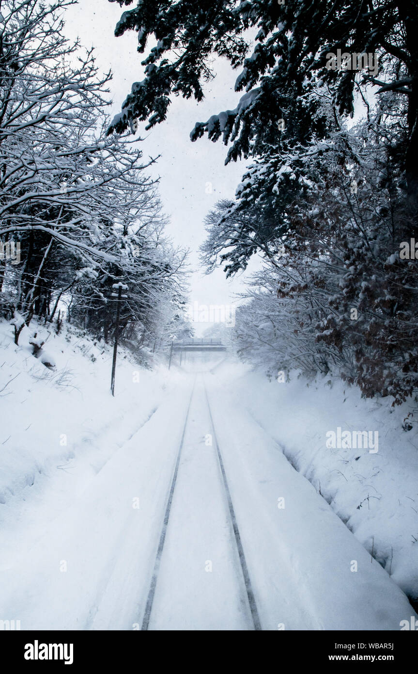 White Snow covered tracks on Tsugaru railway line in Aomori, Tohoku ...