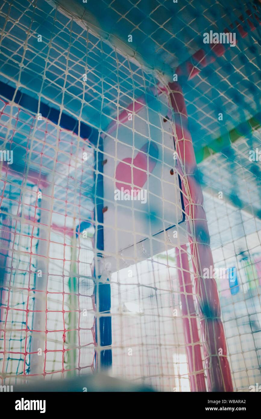 Fence of a daycare playground area Stock Photo - Alamy