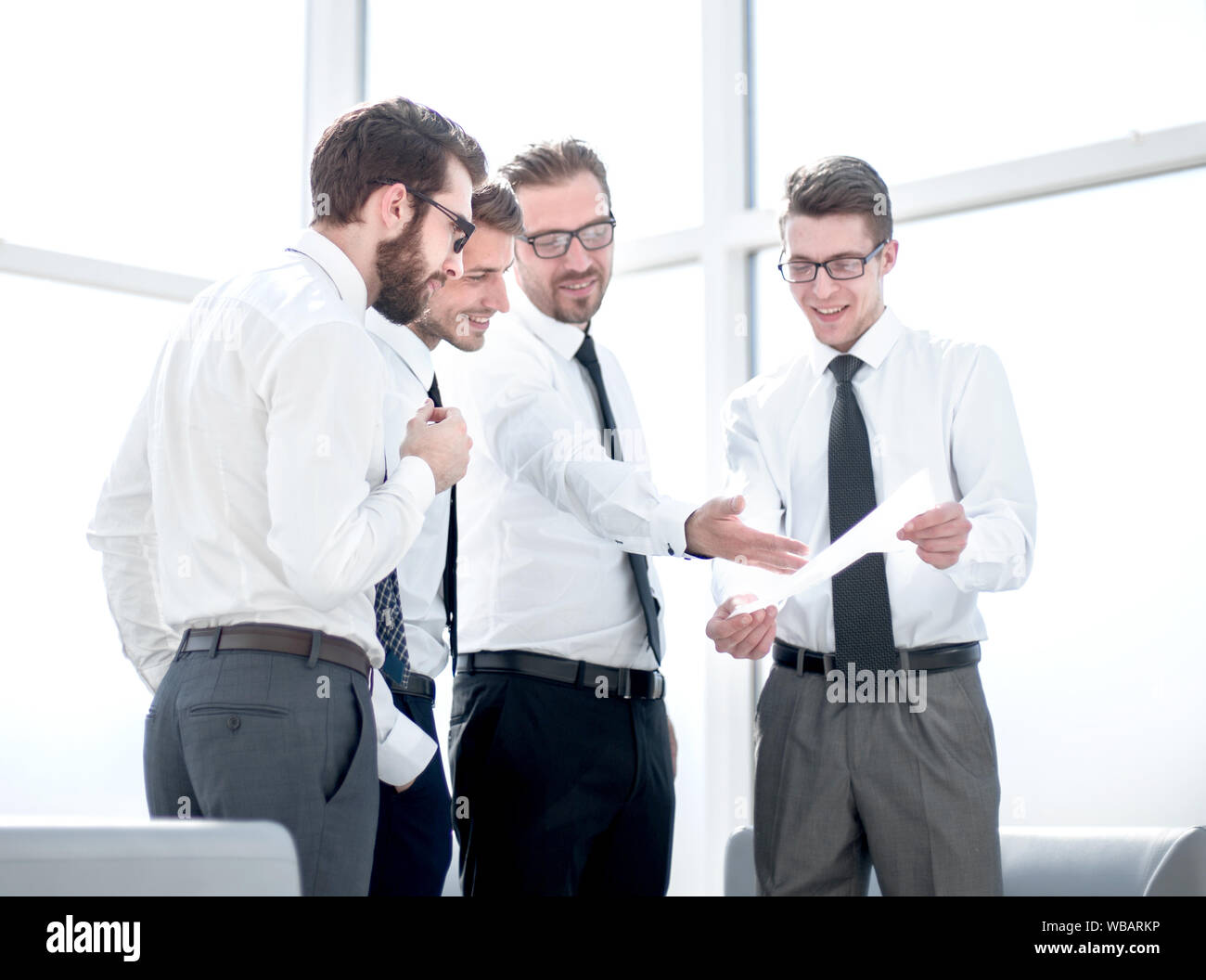 businessman explaining to colleagues the terms of the new contract ...