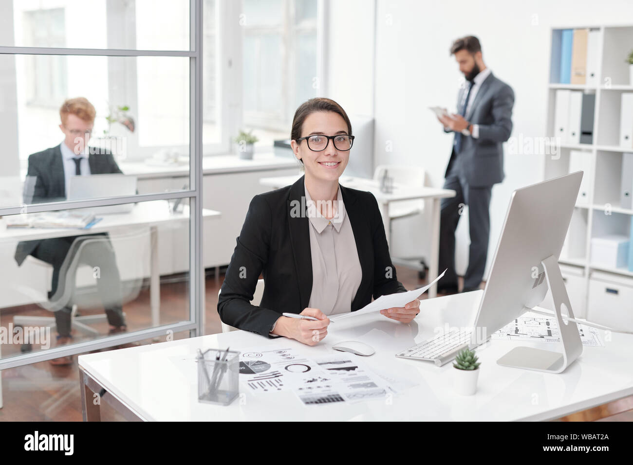 Smiling Business Intern at Workplace Stock Photo - Alamy