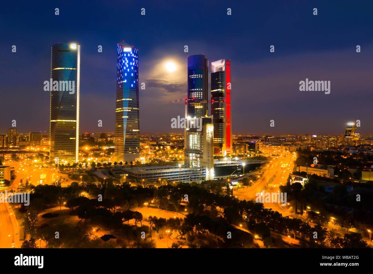 Night aerial view of modern Madrid cityscape with tallest skyscrapers ...