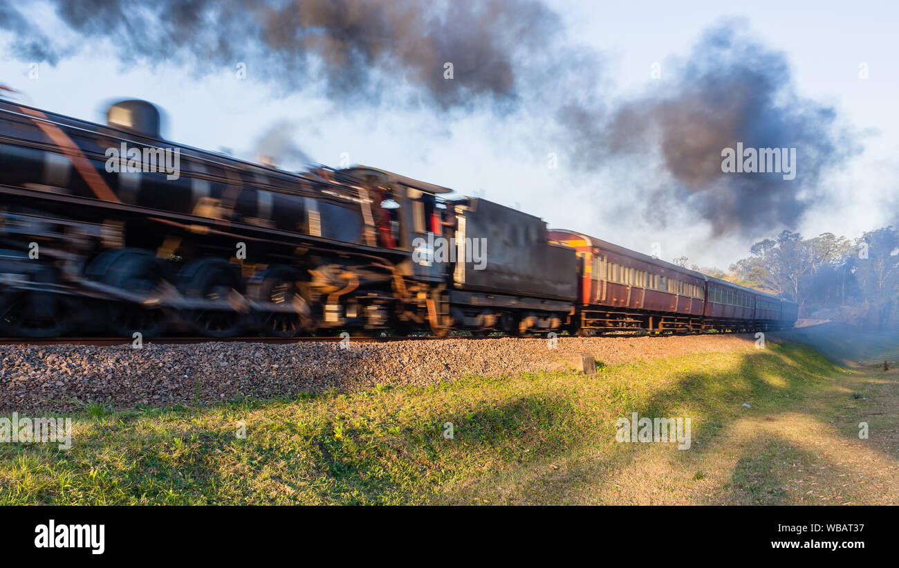 Steam Train locomotive with tourism coaches closeup motion blur on ...