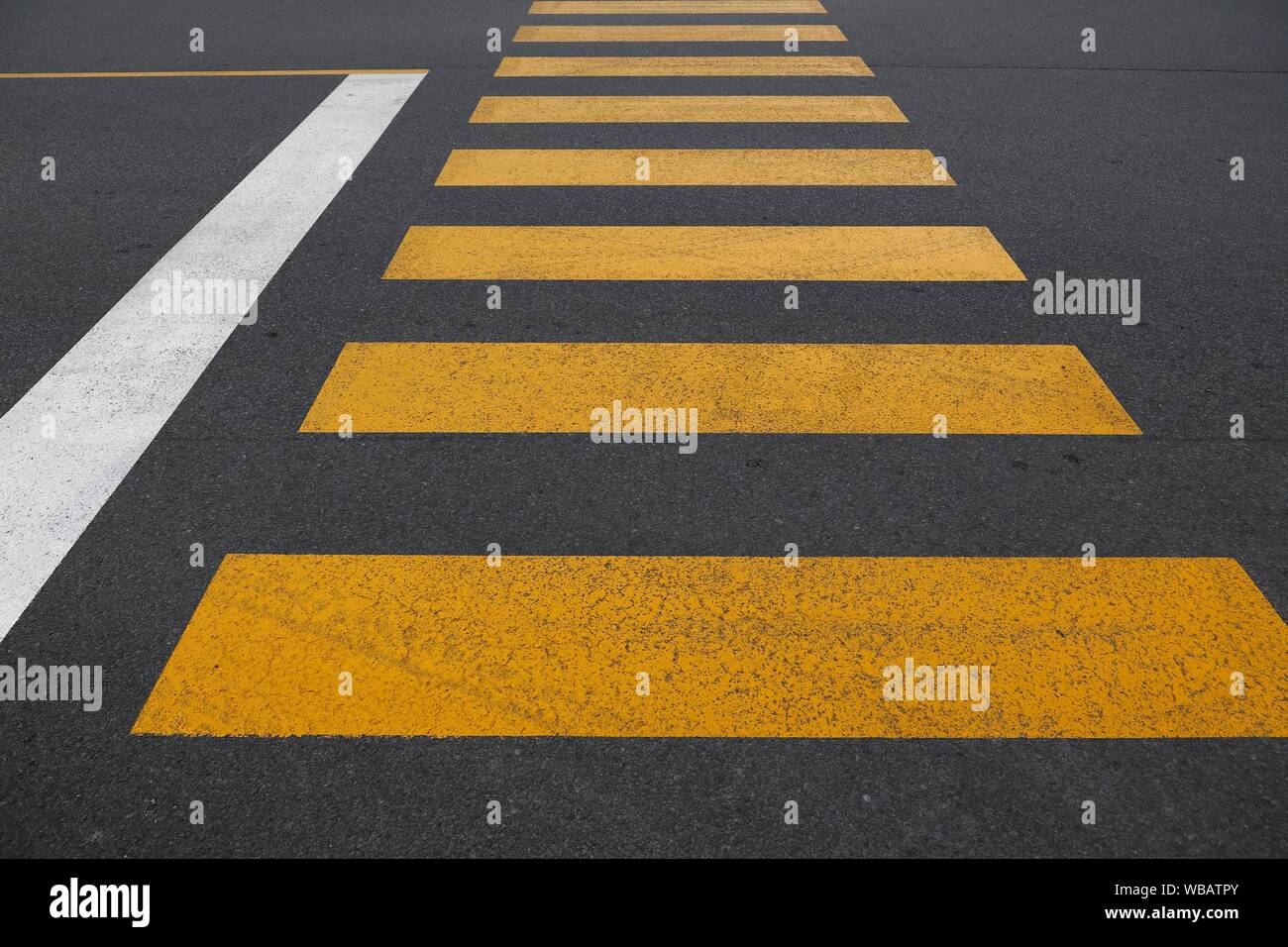 Pedestrian crossing with a white stopping line hi-res stock photography ...