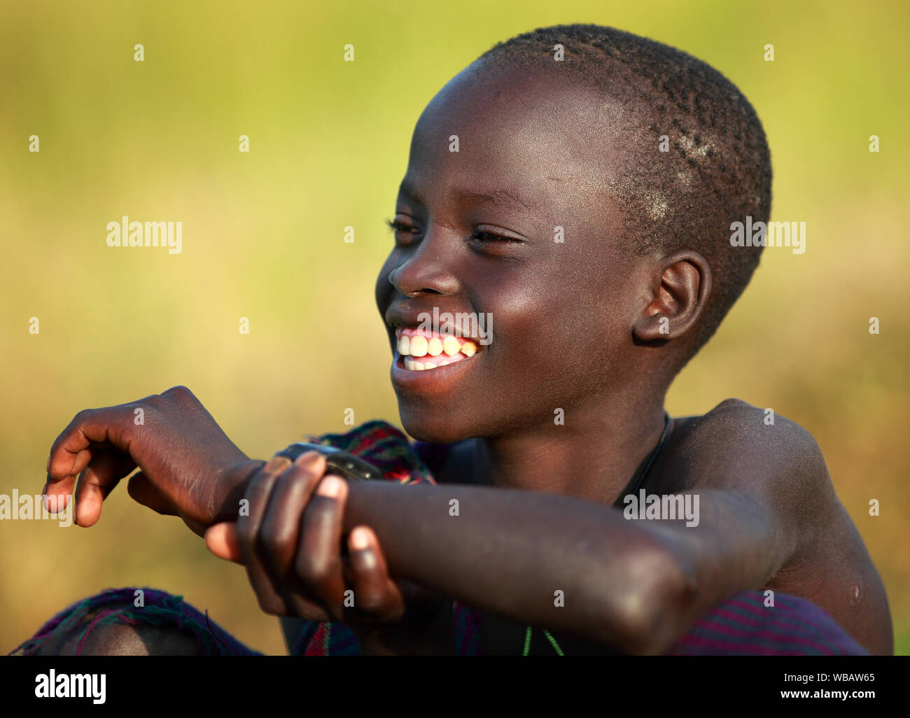 Young tribal Suri boy at a ceremony in Lower Omo Valley near Kibish ...