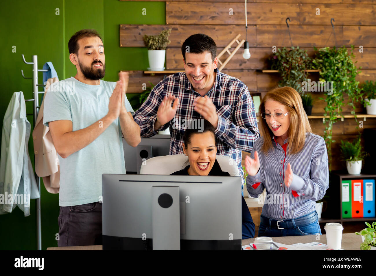 Office workers celebrating big sale hi-res stock photography and images - Alamy