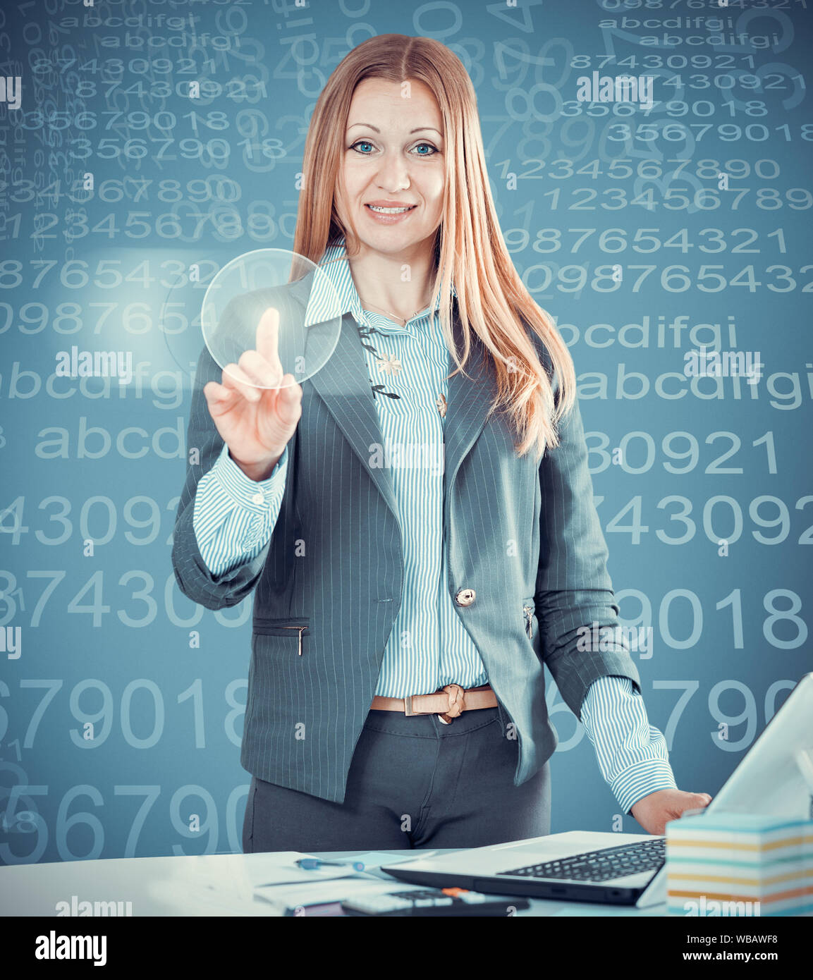 Woman touching screen on the background of modern glass buildings Stock ...