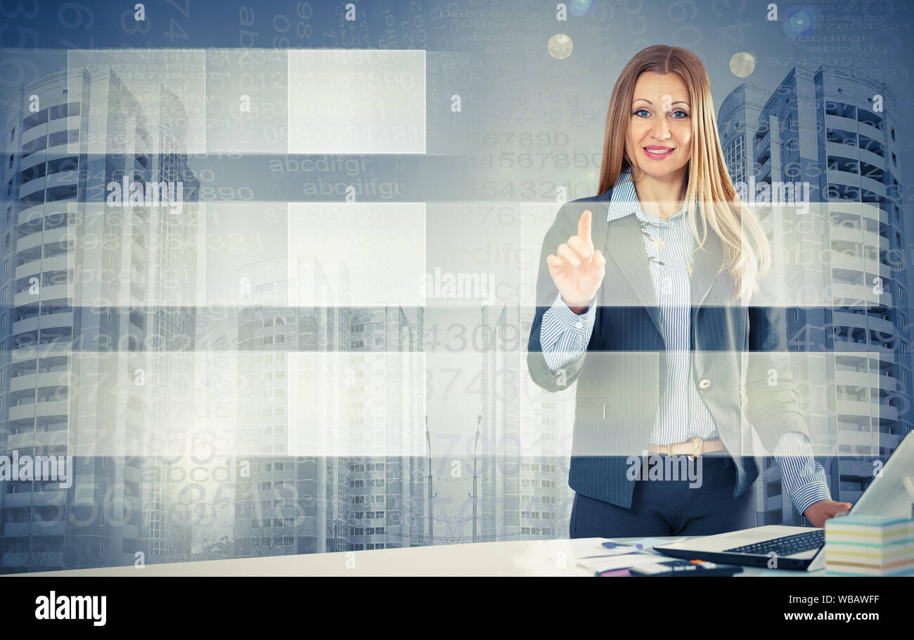 Female in suit testing digital monitor and touchscreen in the megapolis ...