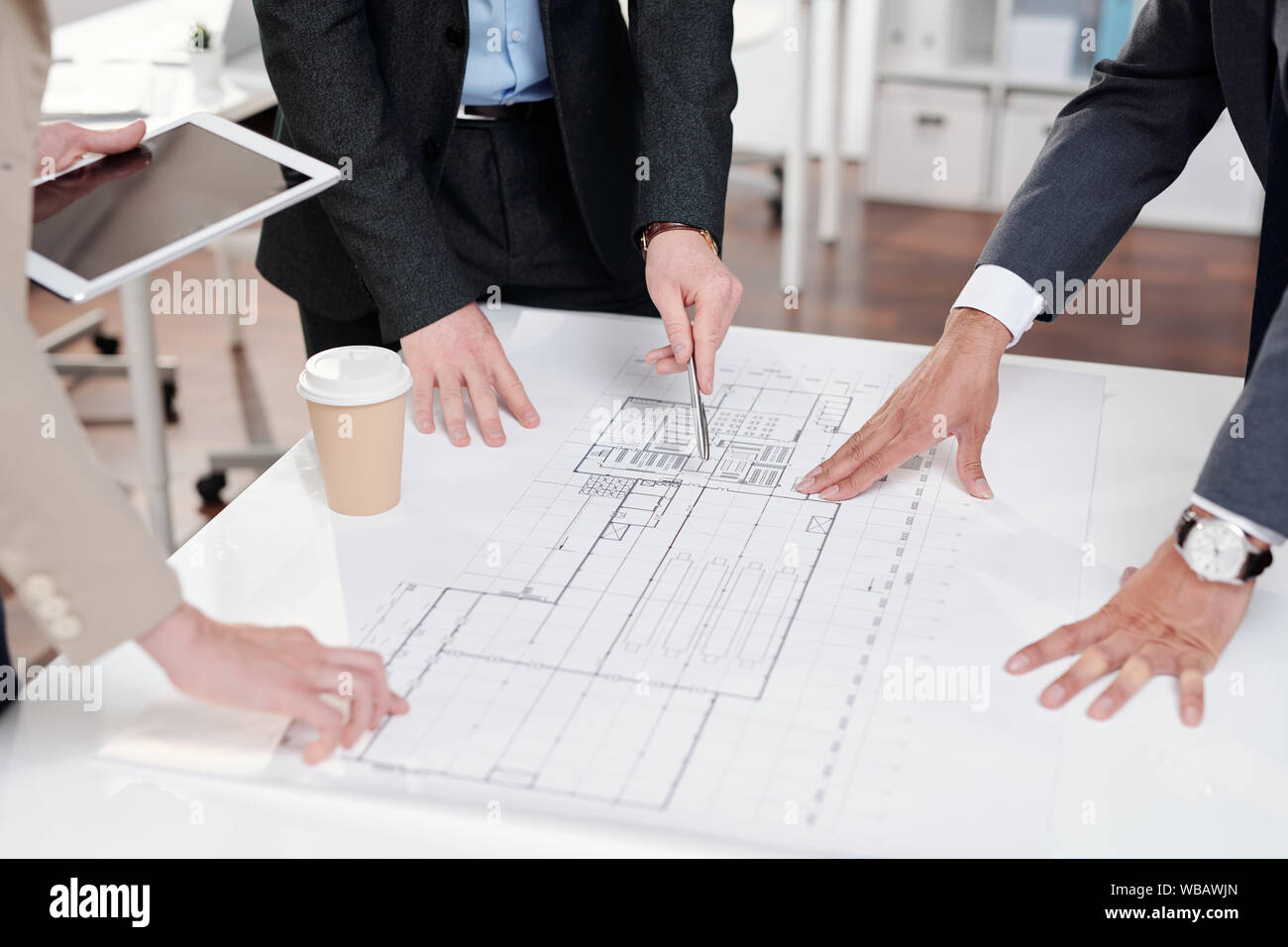 Business People Discussing Floor Plans Stock Photo - Alamy