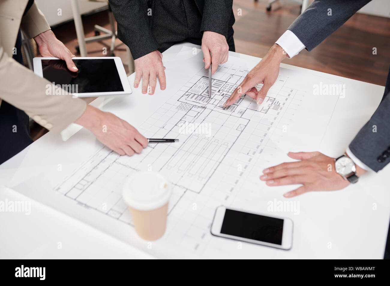 Team of Business People Discussing Construction Plans Stock Photo - Alamy