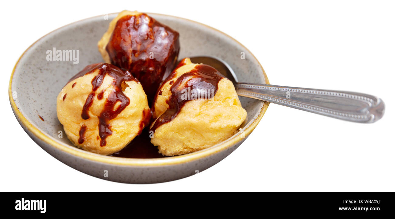 Traditional French choux pastry balls filled with sweet custard ...