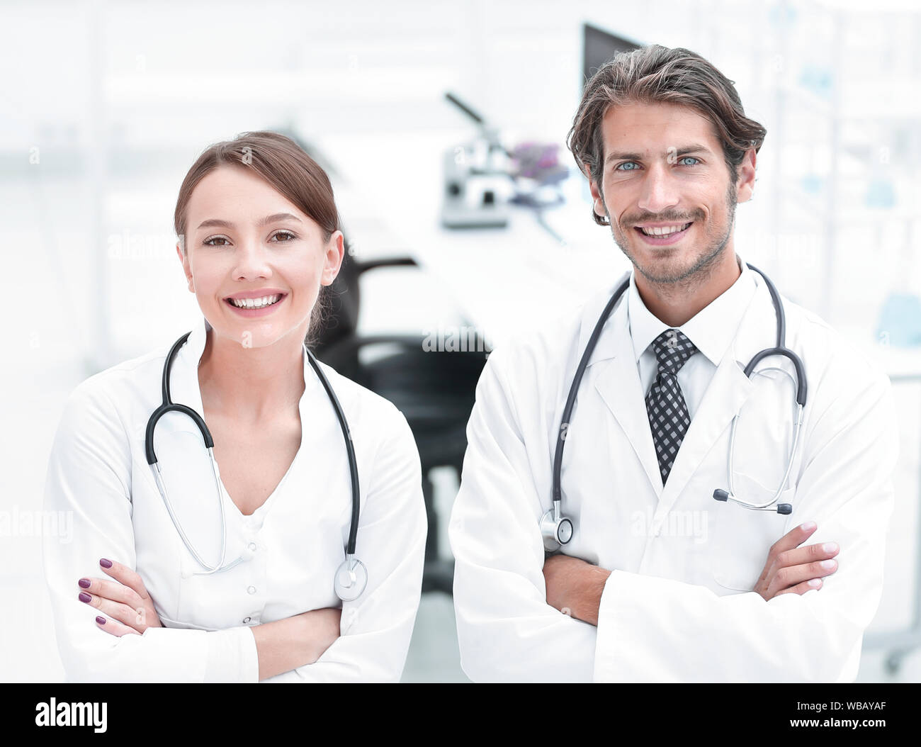 Portrait of two successful professional doctors workers in coats Stock ...