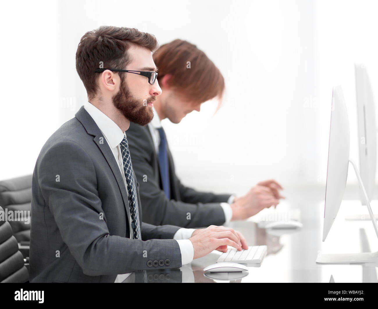 Company employees working in software development Stock Photo - Alamy