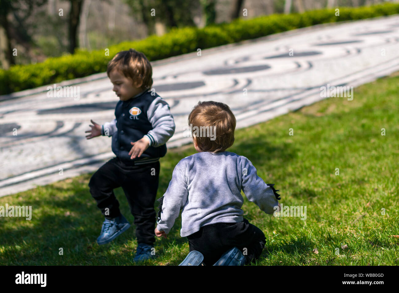 Happy kids in the spring Stock Photo - Alamy