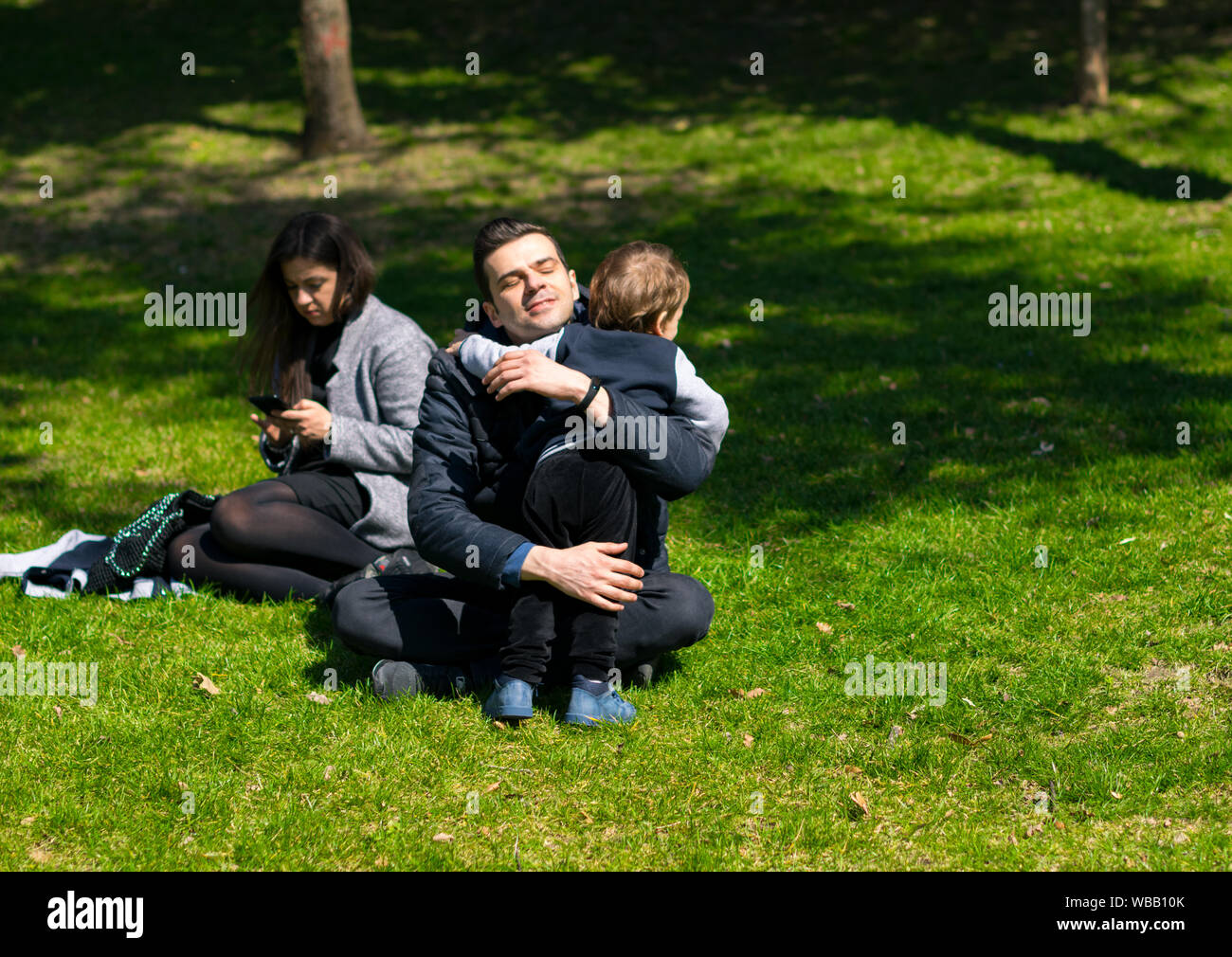 Baby running to his father in spring Stock Photo - Alamy