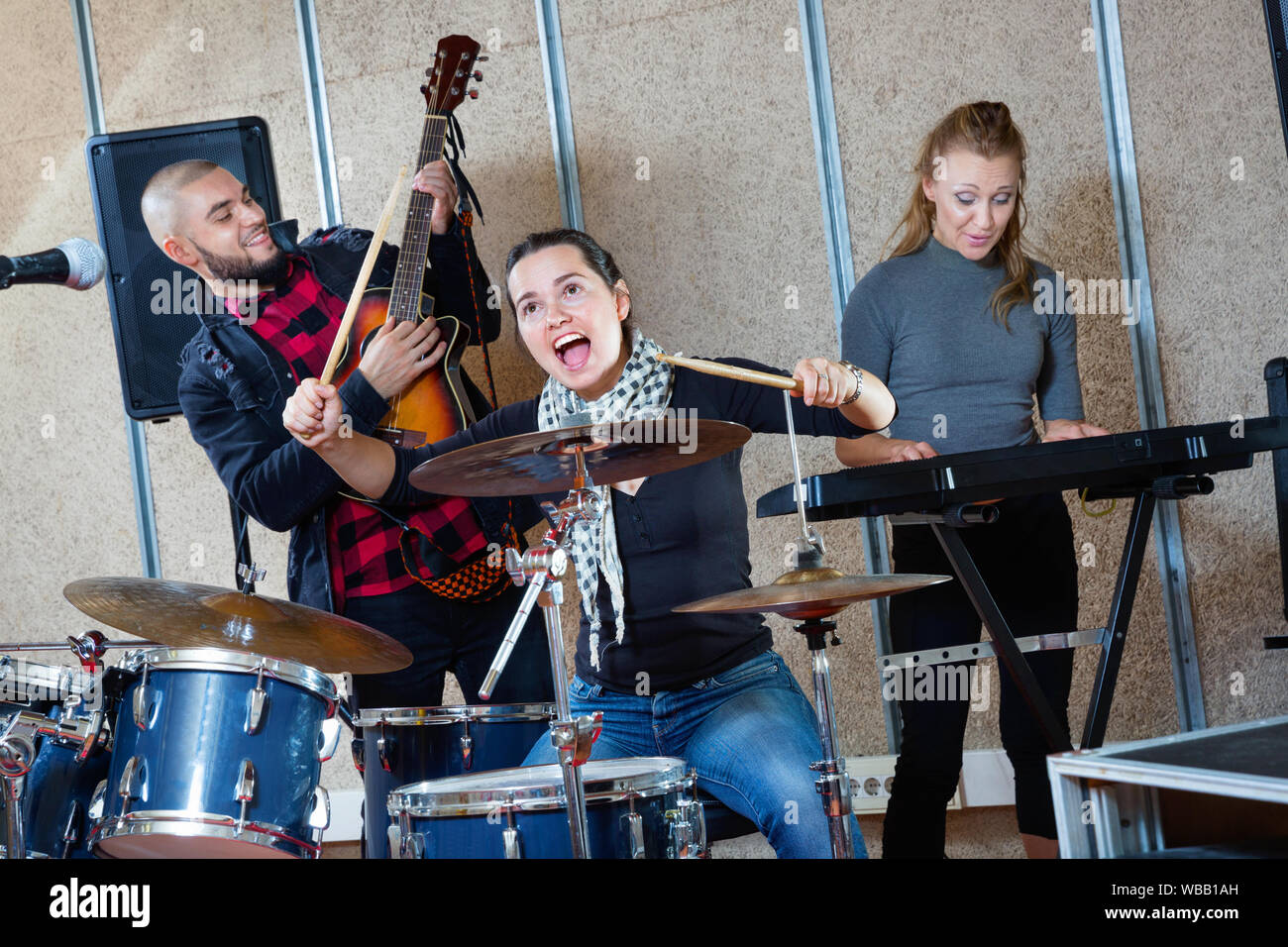 Passionate emotional happy cheerful positive smiling female drummer ...