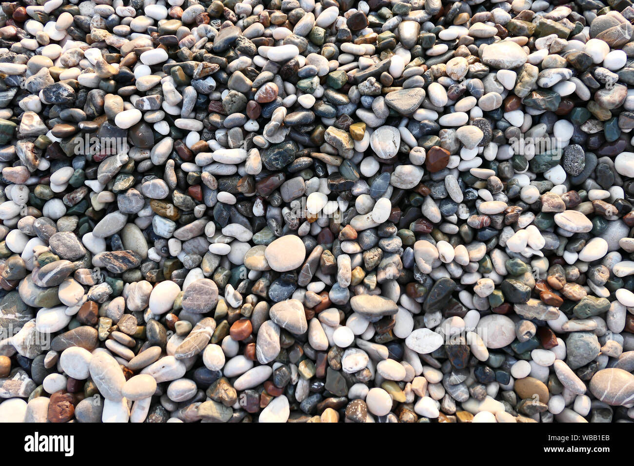 Grey pebble as a background Stock Photo - Alamy