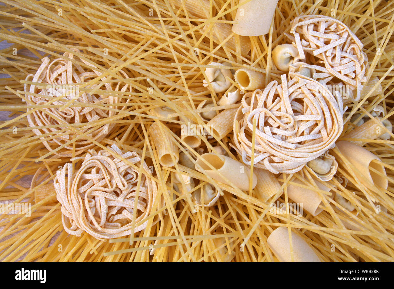 Varieties of pasta - spaghetti, tagliatelle and rigatoni. Italian ...