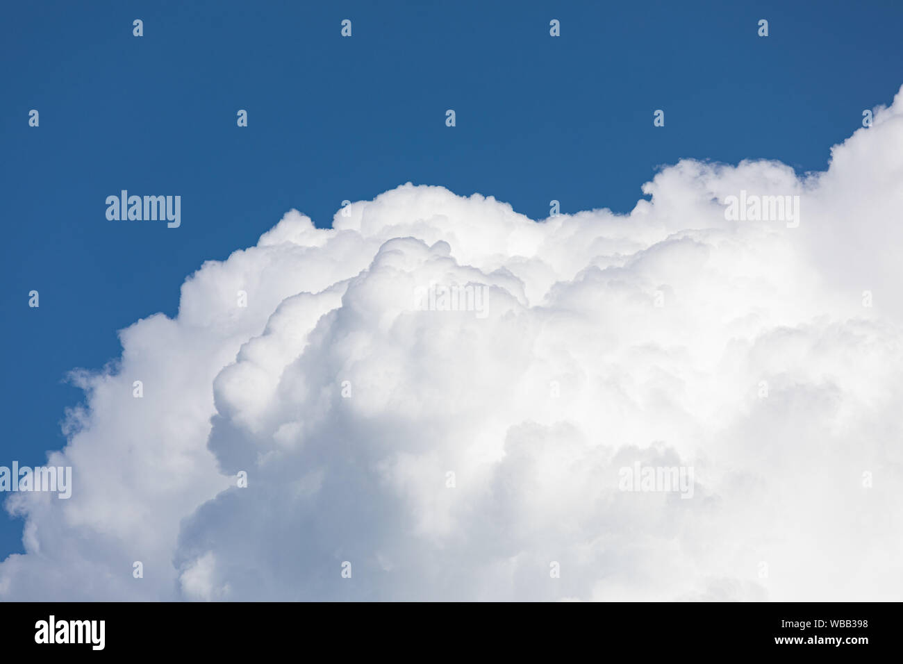 Fluffy cloud edge and blue sky Stock Photo - Alamy