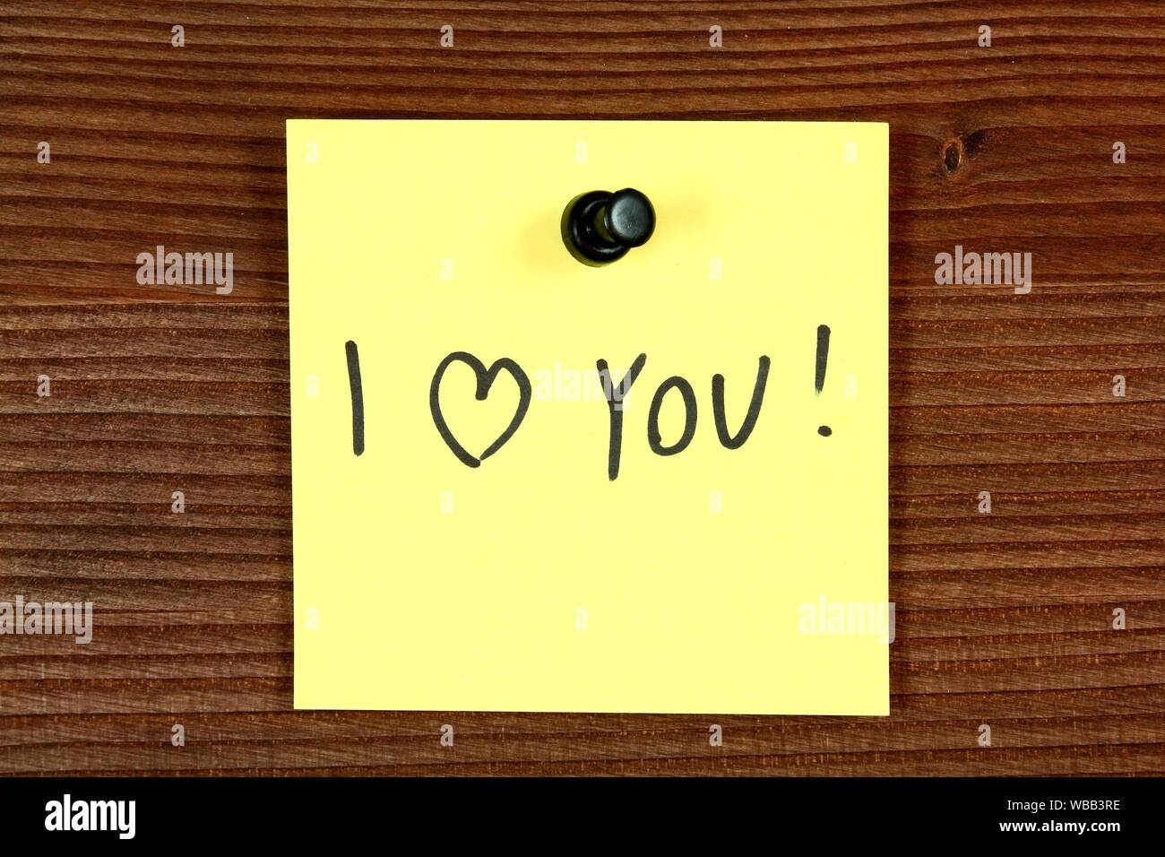 Sticky note with love message - I love you. Bulletin board Stock Photo ...