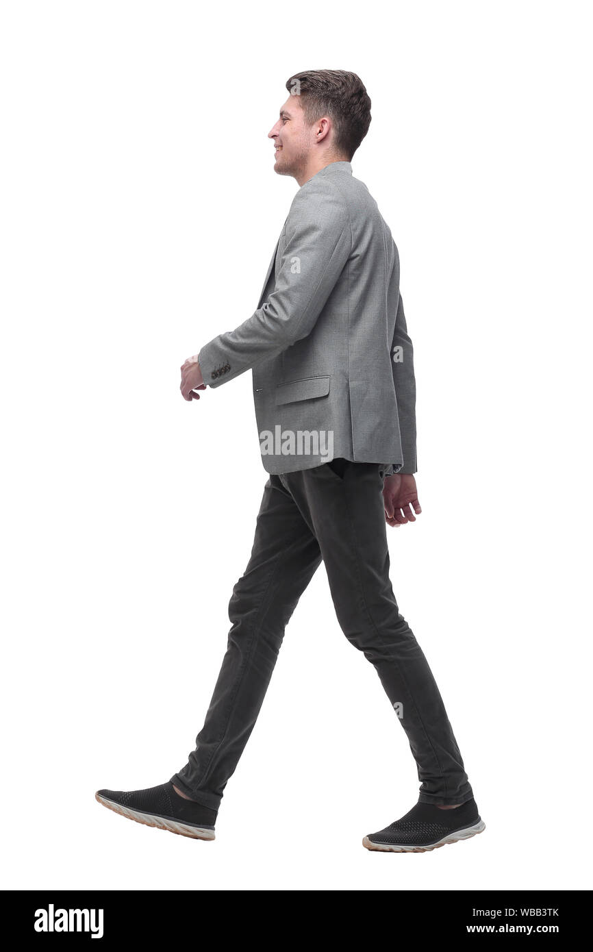 serious young man stepping forward. isolated on white Stock Photo - Alamy