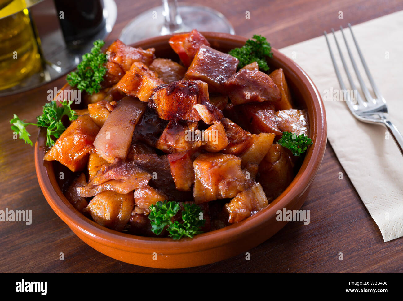 Traditional spanish dish Morro de cerdo - braised pig snouts served in ...
