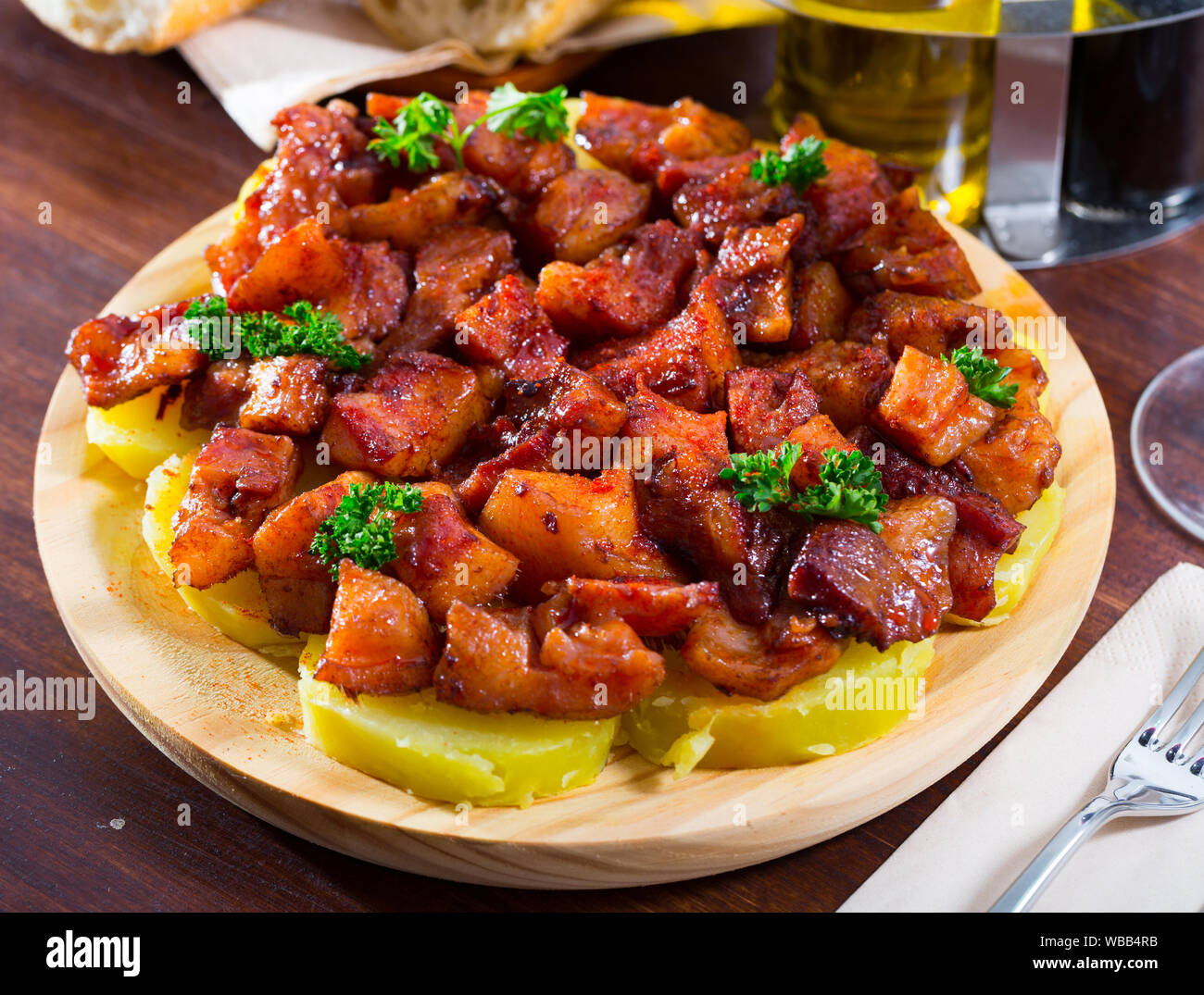Roasted snouts of pigs with pepper on baked potato – Spanish dish Stock ...