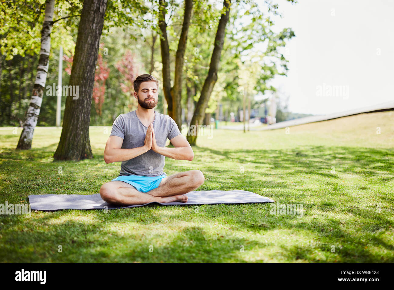 One handsome man meditating hi-res stock photography and images - Alamy