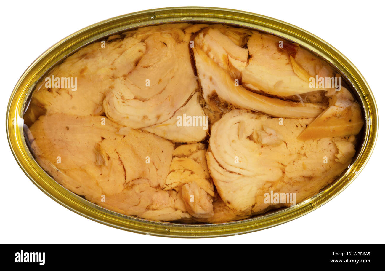 Closeup of open can of tuna preserves in oil. Isolated over white ...